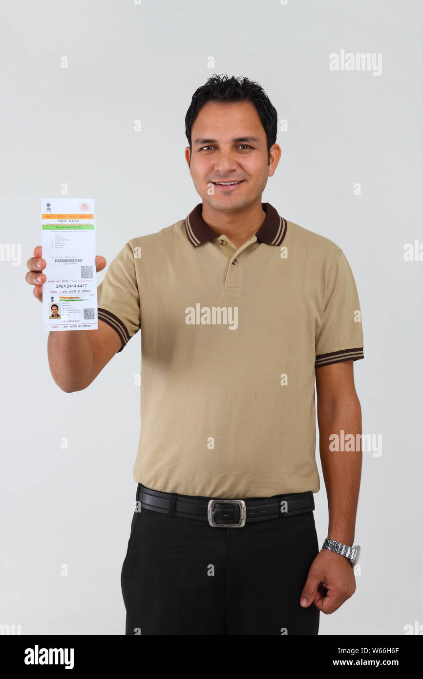 Man showing an Aadhar card Stock Photo - Alamy