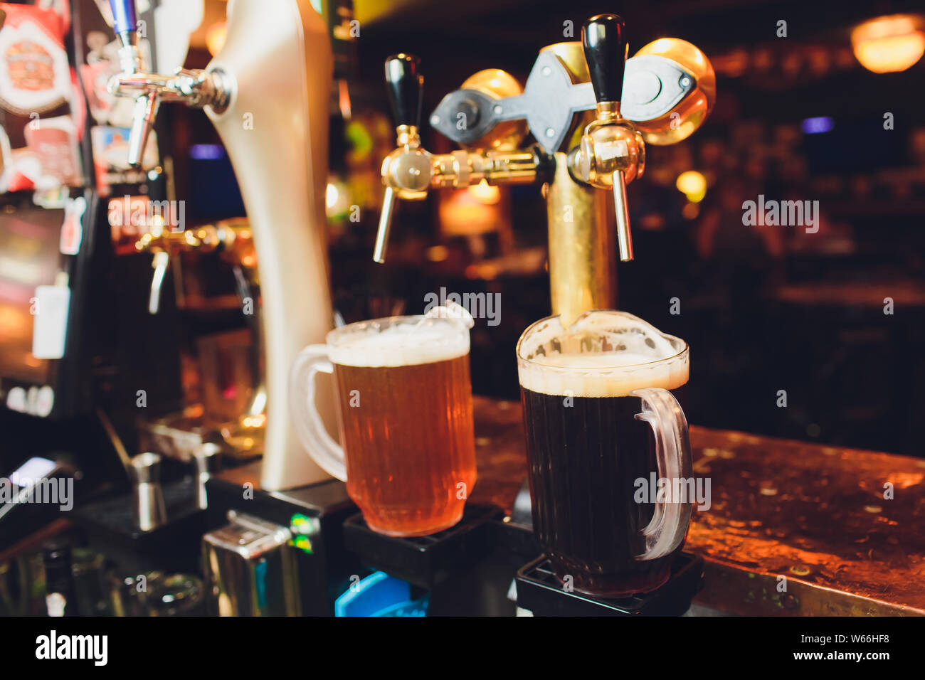 Close up of beer taps in row. Metallic equipment for bars and mini ...