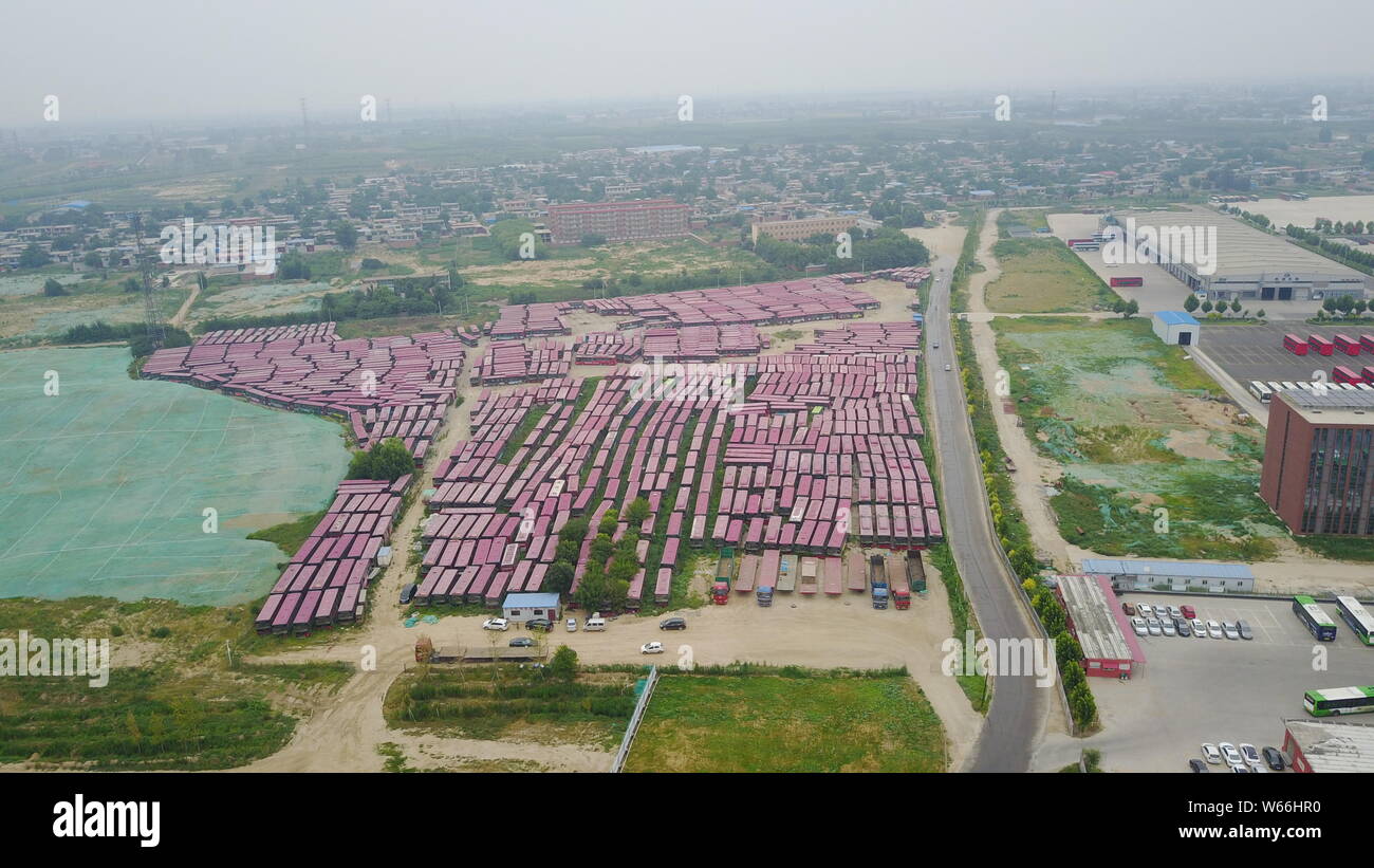 An aerial view of a bus "graveyard" crammed with discarded buses in an ...