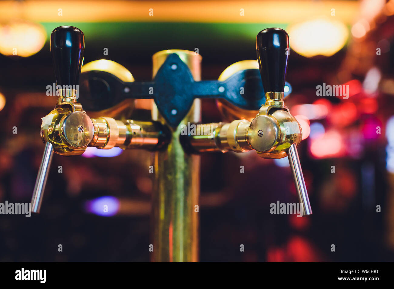 Close up of beer taps in row. Metallic equipment for bars and mini ...