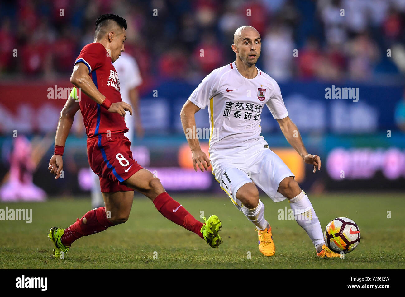 Polish football player Adrian Mierzejewski of Changchun Yatai, right ...