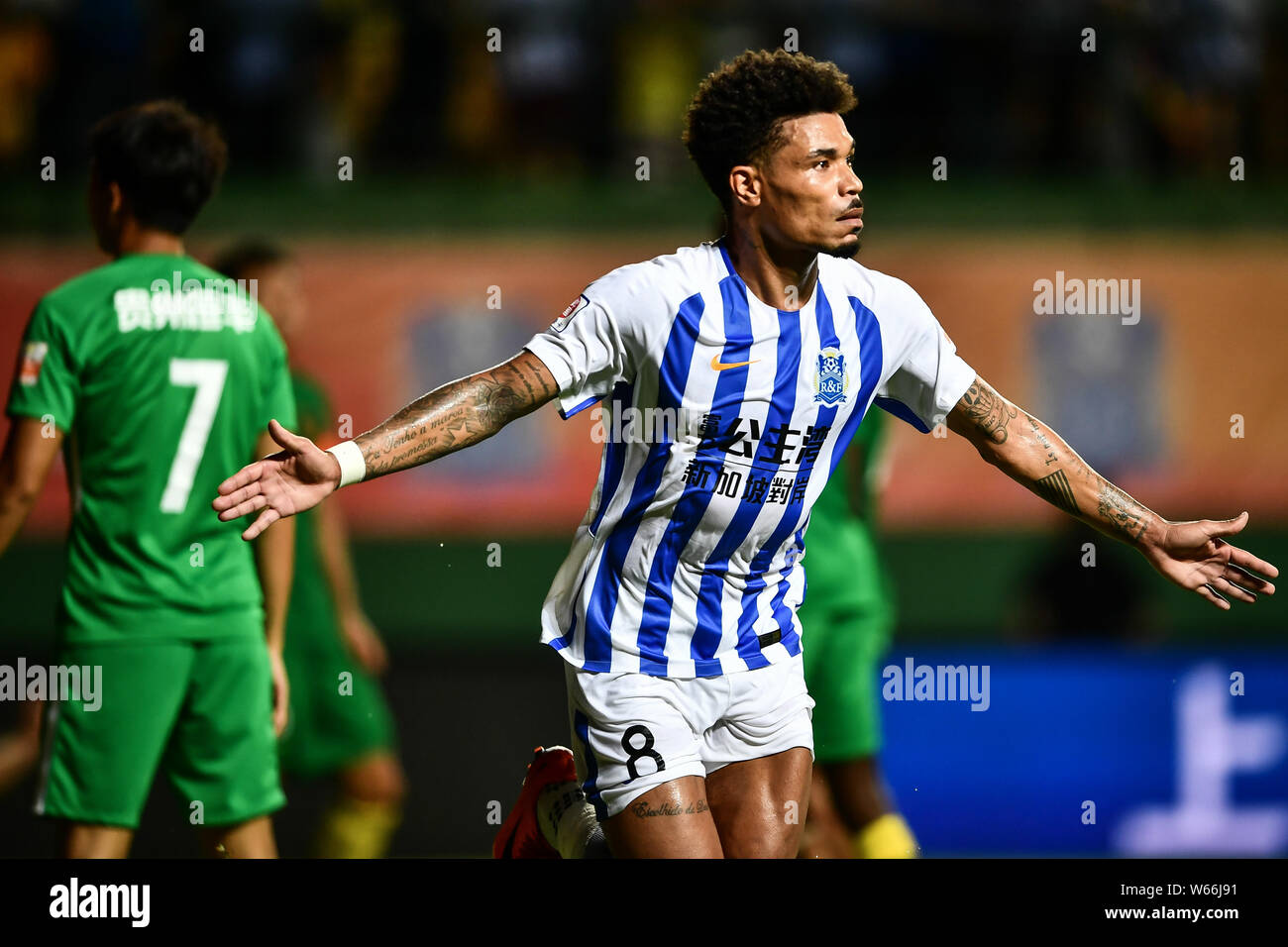 Brazilian football player Junior Urso of Guangzhou R&F celebrates after ...