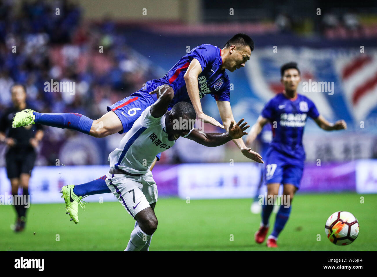 Ghanaian football player Frank Acheampong, below, of Tianjin TEDA ...