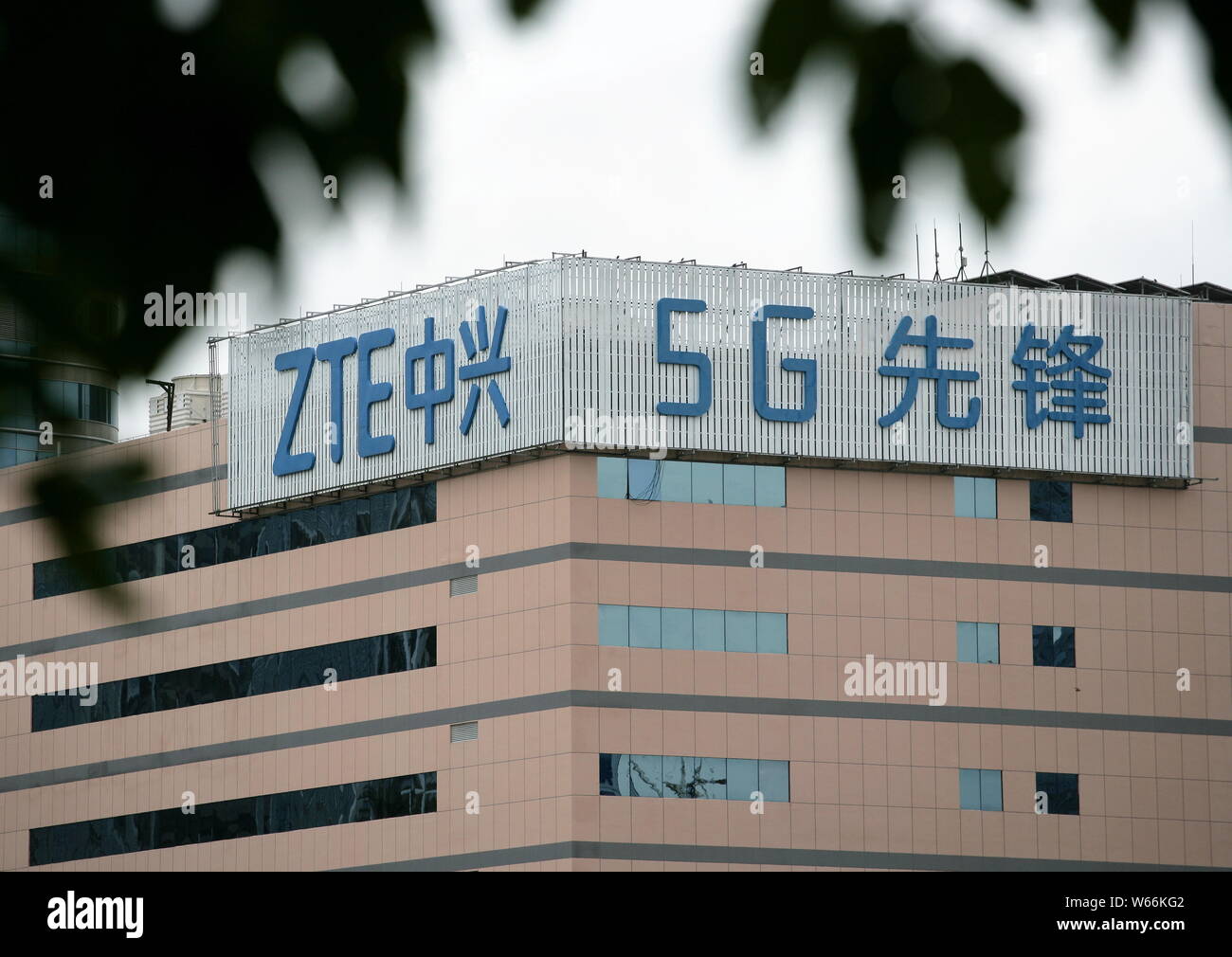 A signboard of ZTE and a logo of 5G are seen at the headquarters of ZTE ...