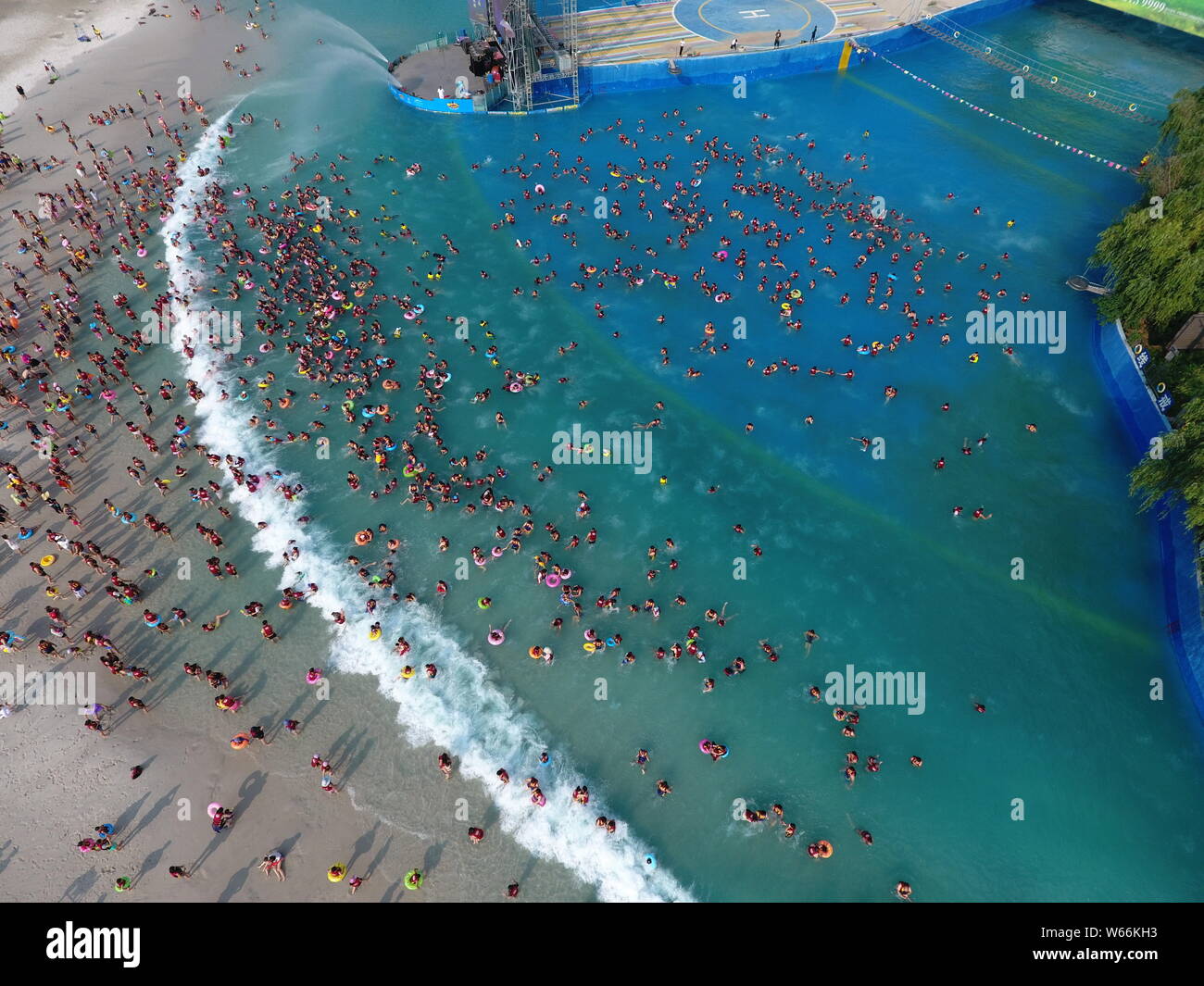 Chinese holidaymakers crowd a water park in Zhengzhou city, central ...
