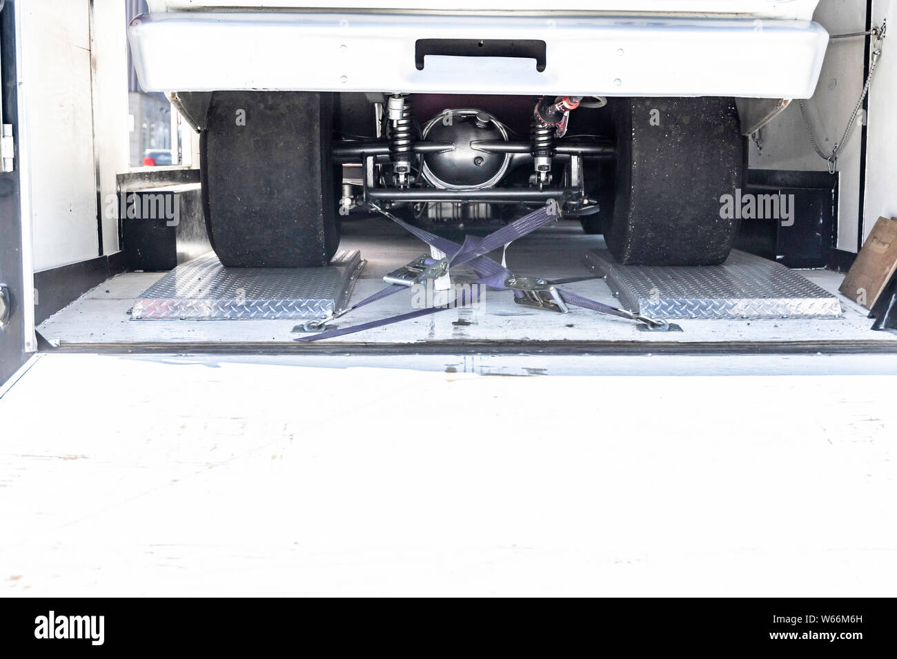 Extra wide tire on drag racing car in trailer Stock Photo - Alamy