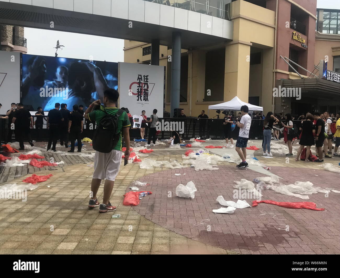 Garbage left by fans is pictured on the ground in front of a sportswear ...