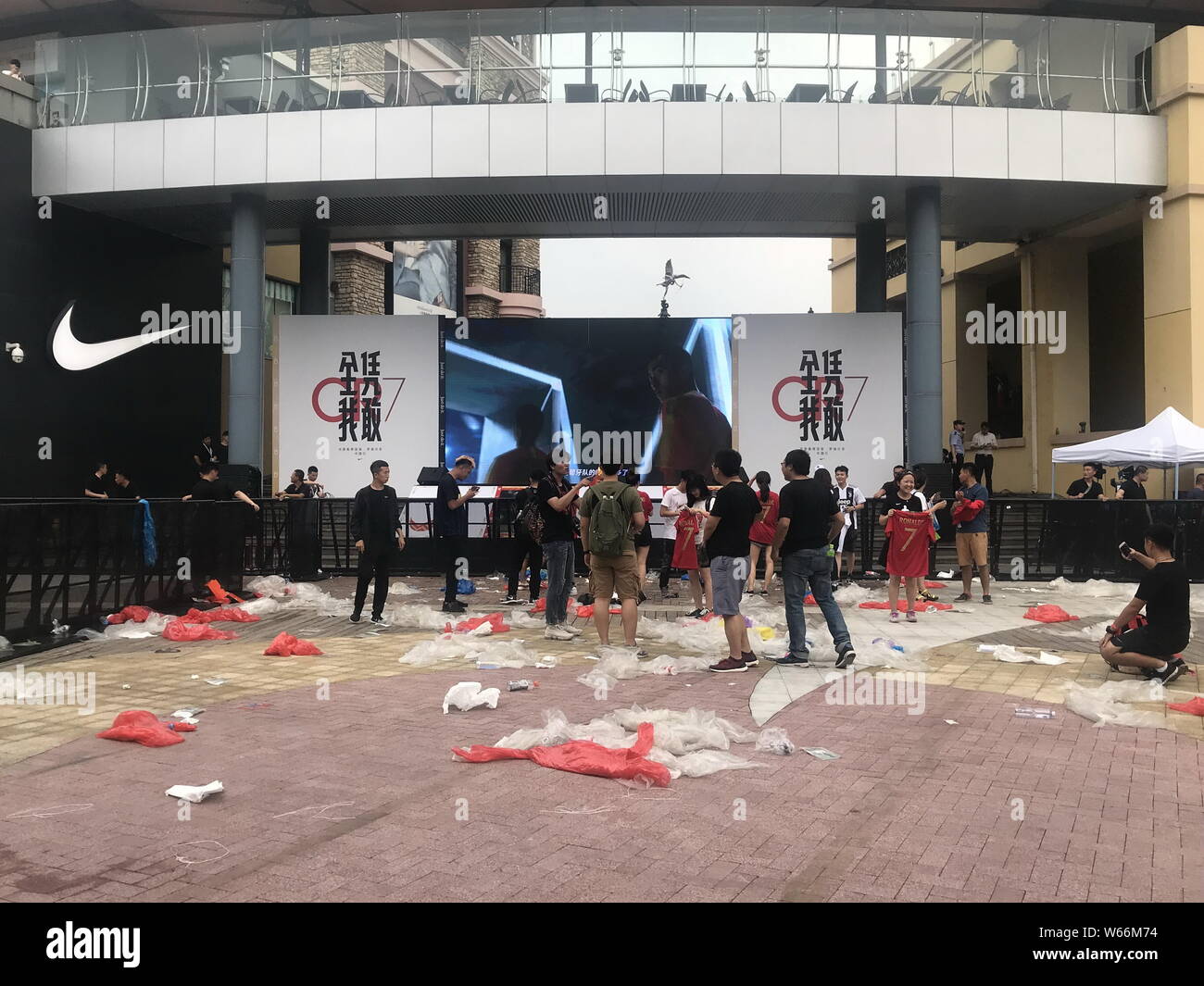 Garbage left by fans is pictured on the ground in front of a sportswear ...