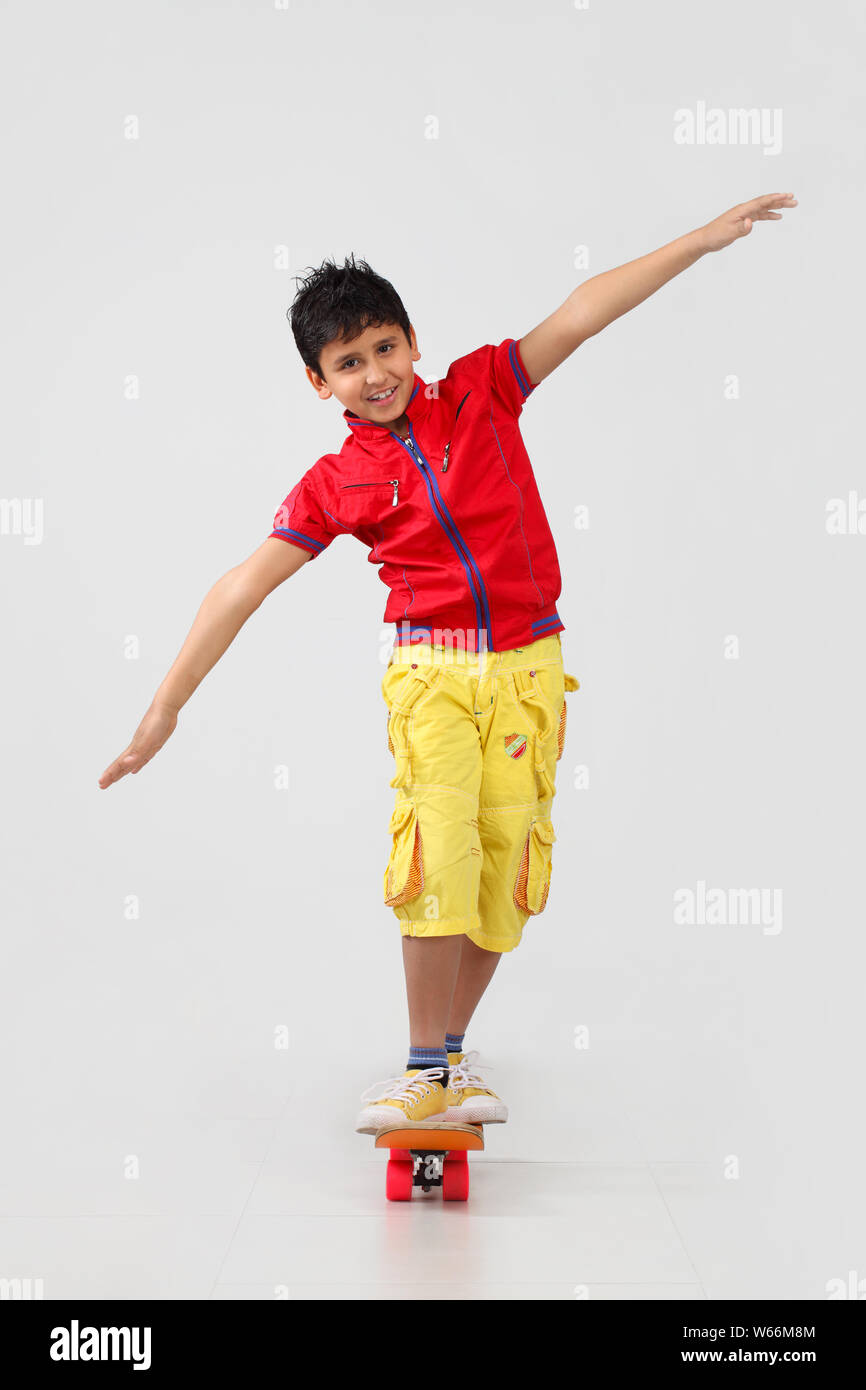 Boy skateboard looking camera smiling hi-res stock photography and ...