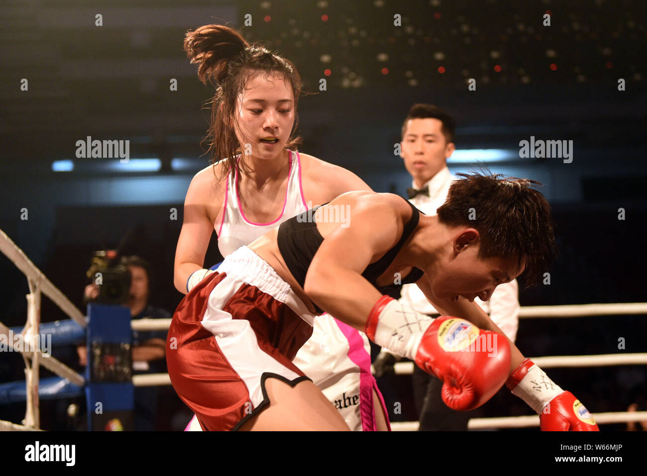 Nanako Suzuki of Japan, back, competes against Wong Ka-yan of Hong Kong ...