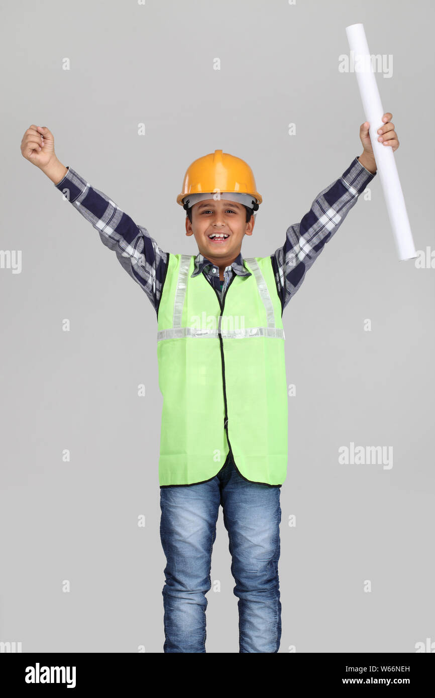 Boy pretending to be an architect and smiling Stock Photo - Alamy