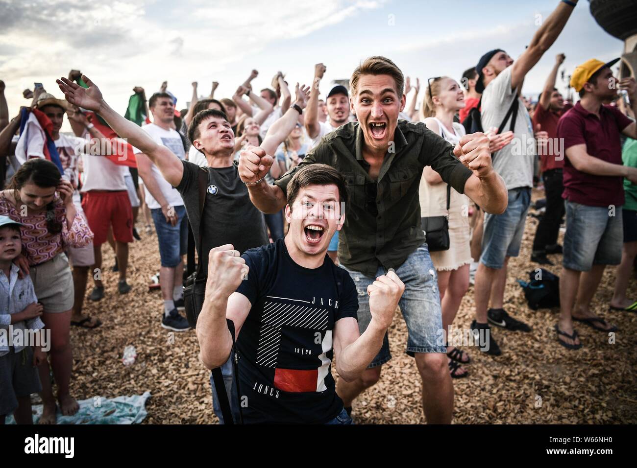 Russian fans celebrate as they watch the Round of 16 match between ...