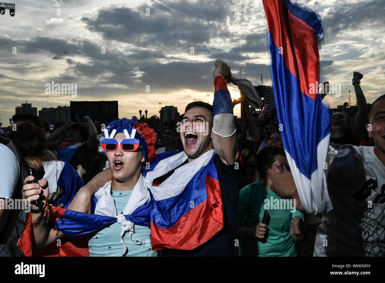 Russian fans celebrate as they watch the Round of 16 match between ...