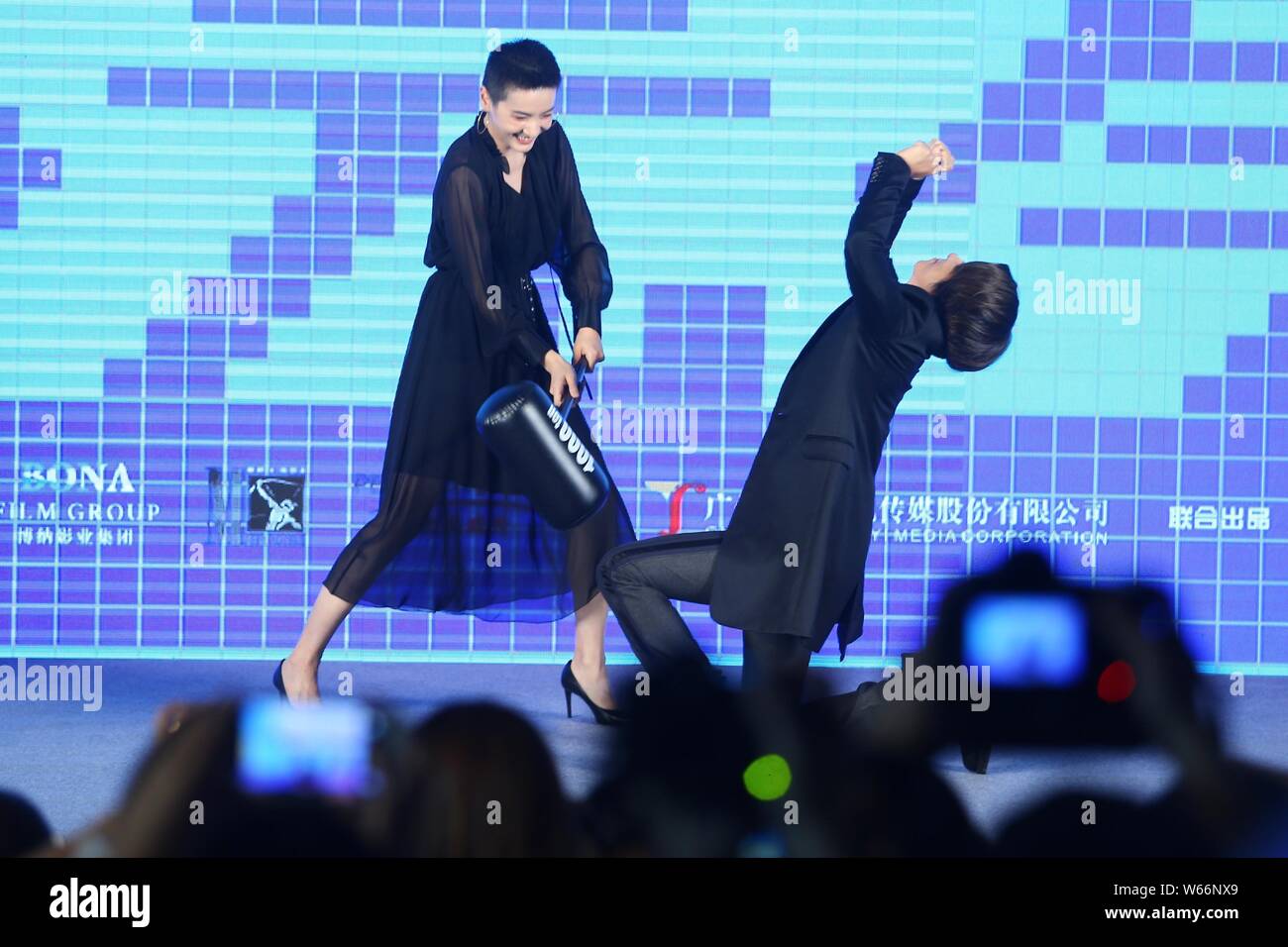 Chinese actress Li Yuan, left, and Japanese actor and singer Tomohisa ...
