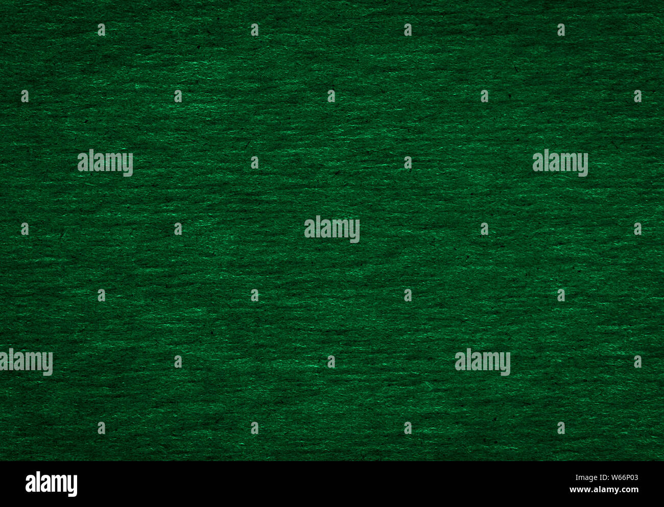 Abstract texture of a rough dark green paper background and copy space ...