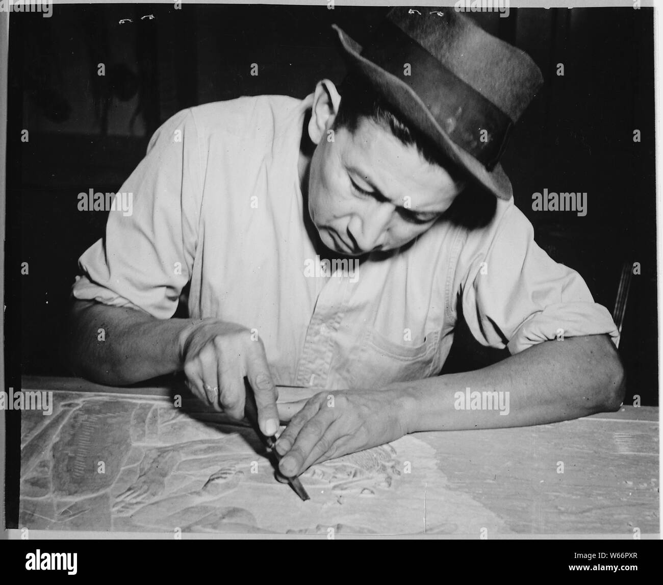 Kidd Smith, Seneca carver, at work in the Tonawanda Community House ...