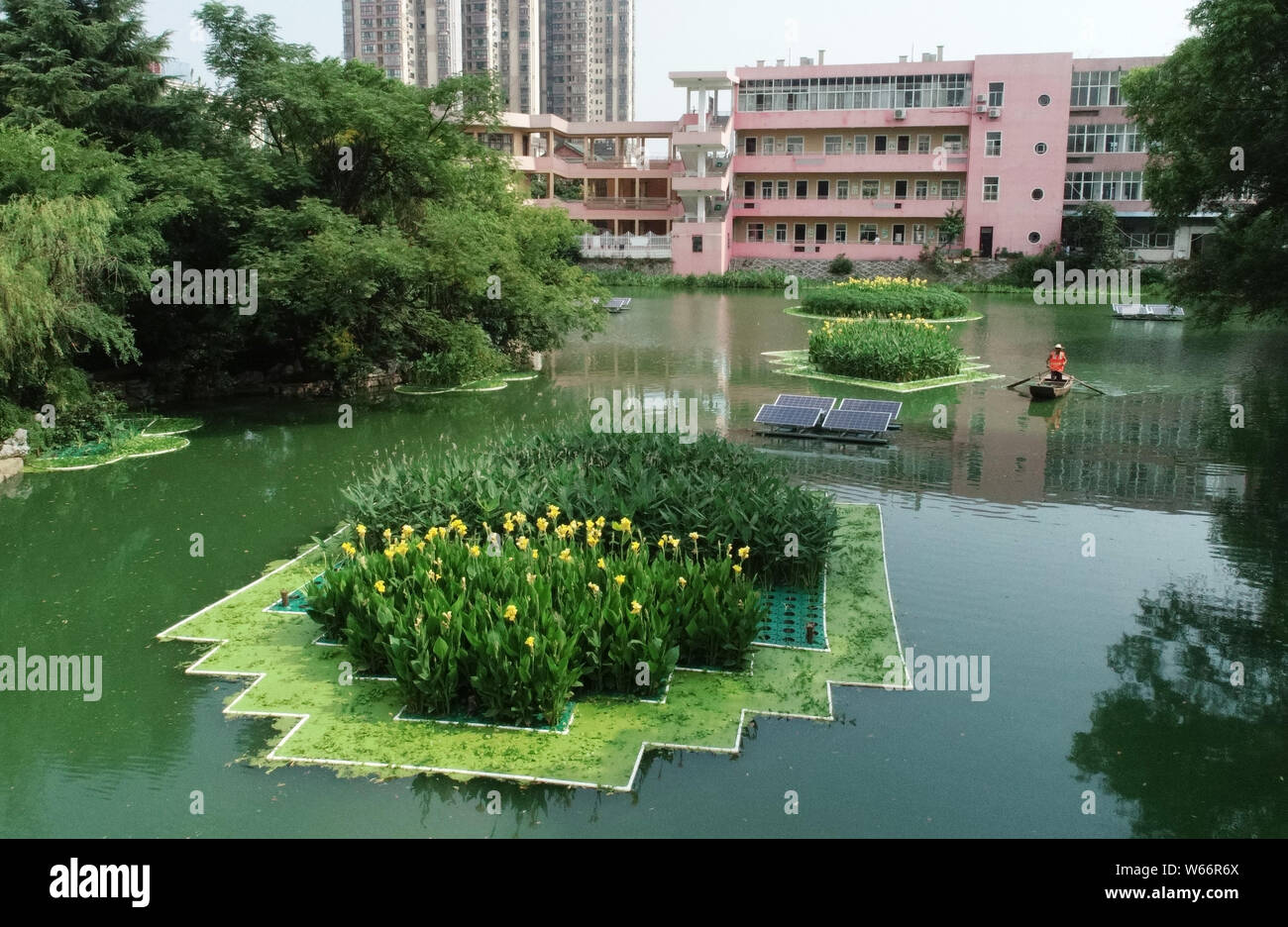 Aerial view of artificial floating islands set in a river for water ...