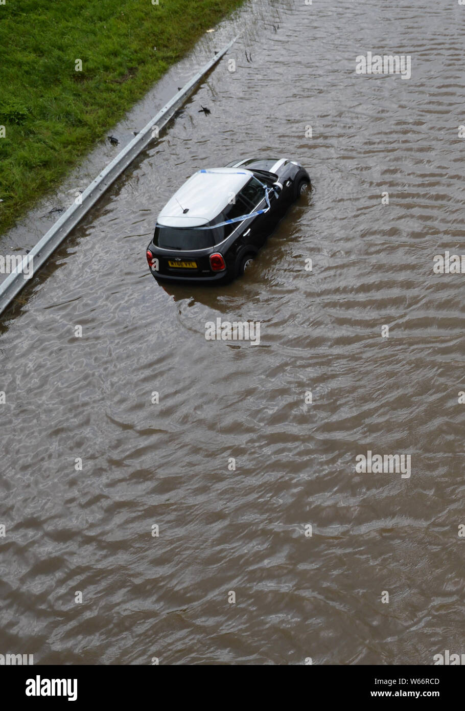Car stranded in flood water on the a555 near handforth hi-res stock ...