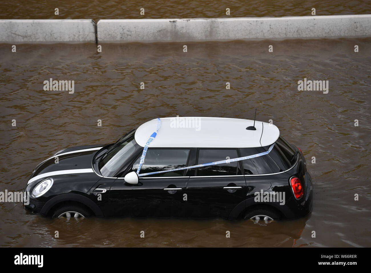 Car stranded in flood water on the a555 near handforth hi-res stock ...