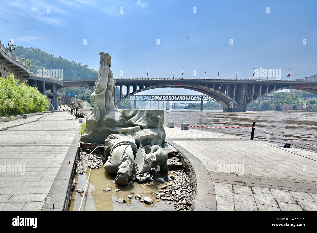 View of the standing statue of Huang Tingjian and the damaged statue of ...