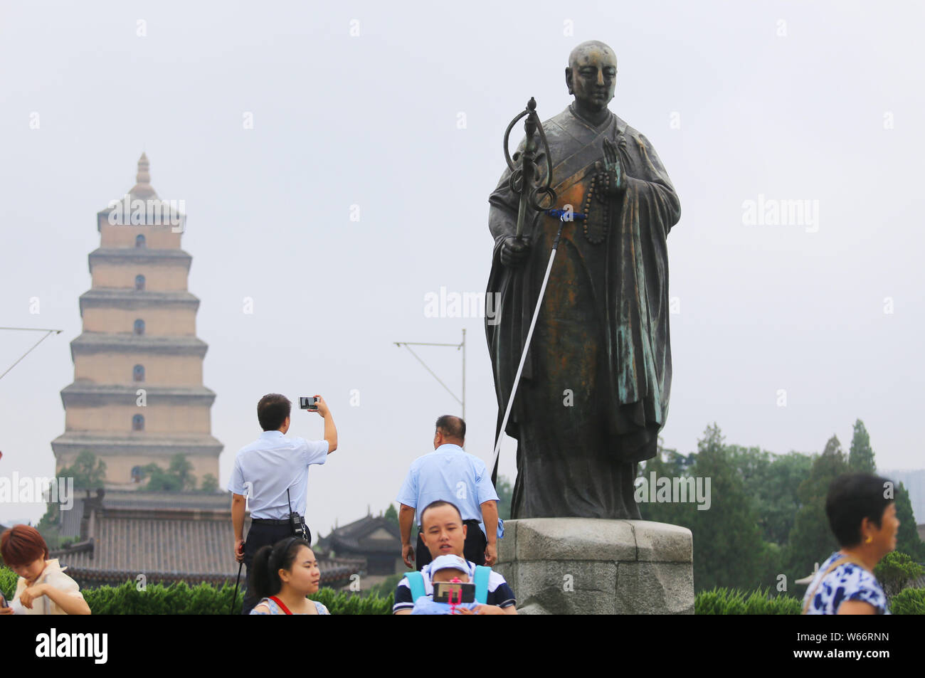 A bronze statue of Chinese Buddhist monk Xuanzang turning green is ...