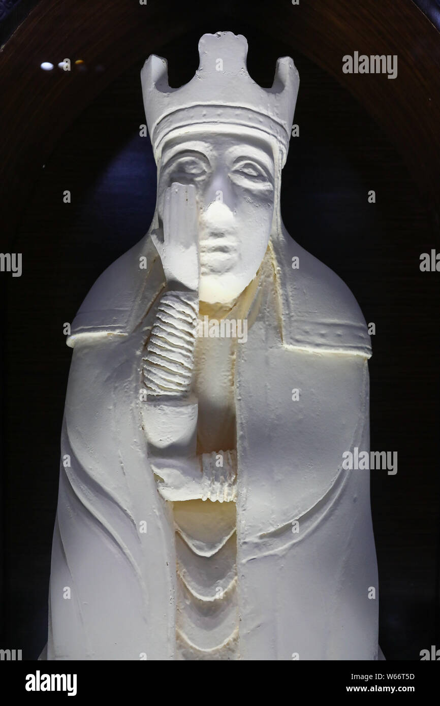 A reproduction of the Lewis Chessmen "Queen" from the British Museum's ...