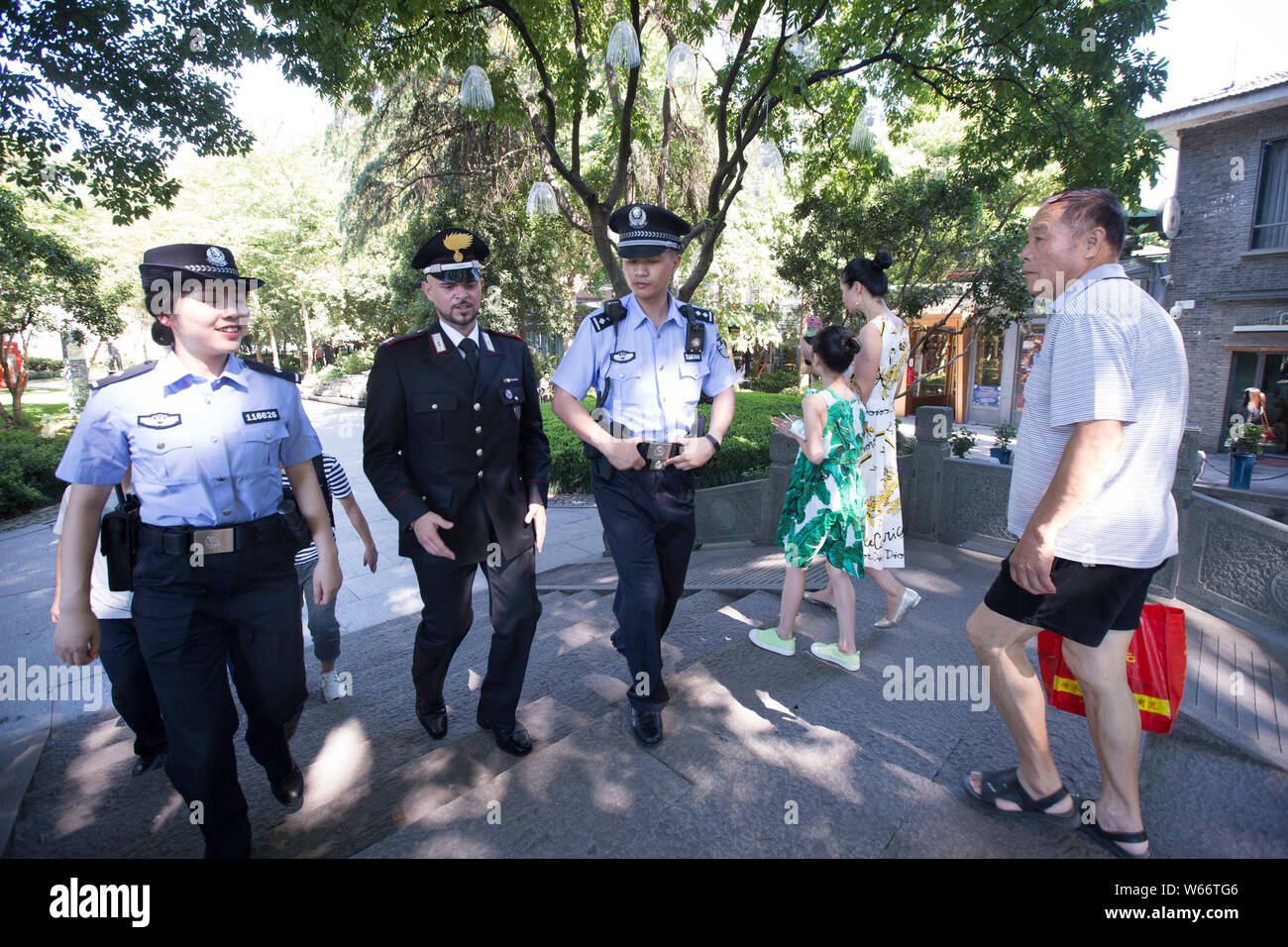 An Italian police officer conducts joint patrols with Chinese police ...