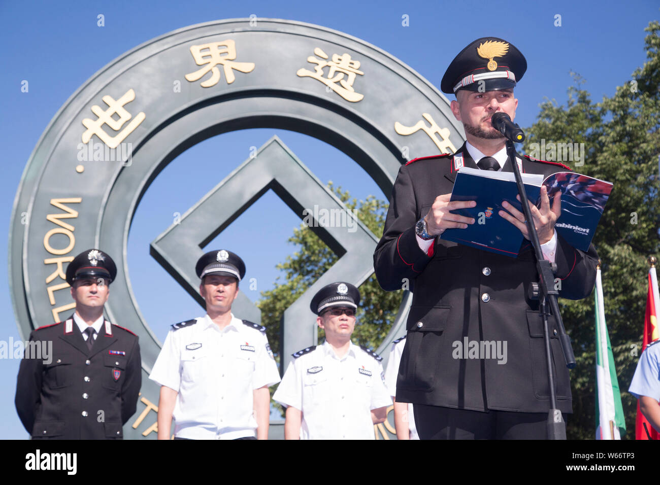 An Italian police officer speaks during a ceremony to mark the start of ...