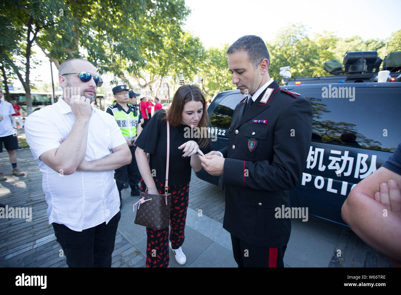 An Italian police officer conducts joint patrols with Chinese police ...