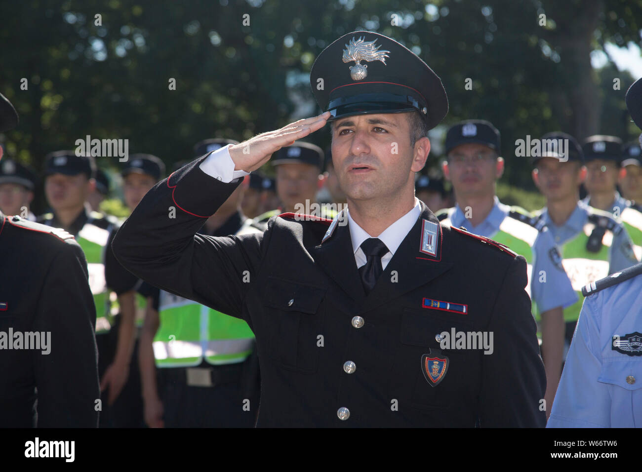 Italian police officers salute during a ceremony to mark the start of ...