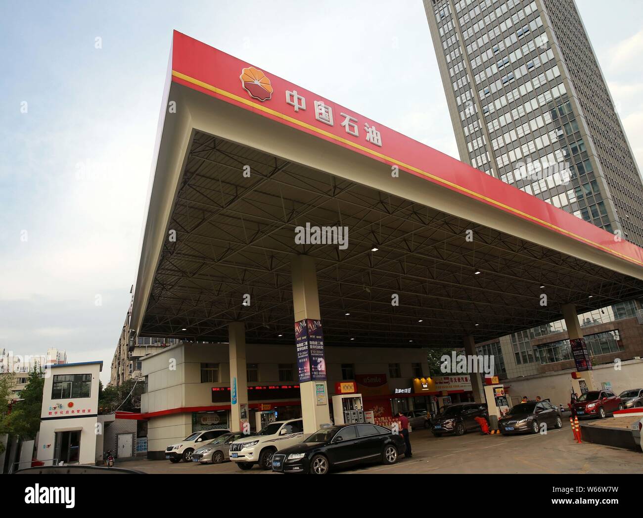 --FILE--Vehicles queue up to be refueled at a gas station of CNPC ...