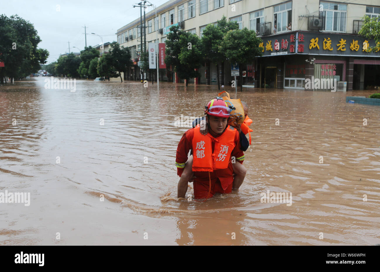 Chinese rescuers evacuate local residents in floodwater caused by heavy ...
