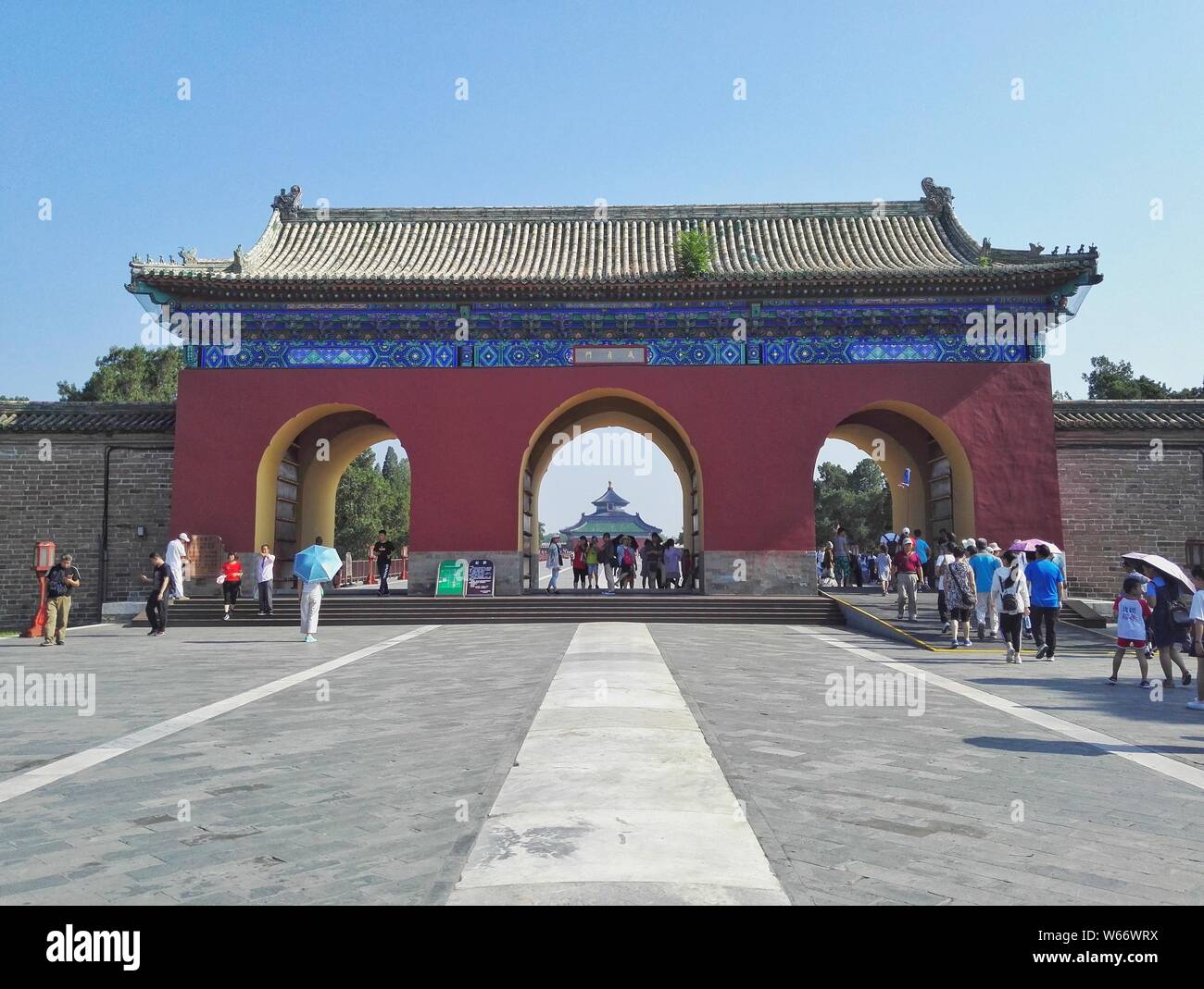 Tourists visit a historic scenic spot along the Zhongzhou Road ...