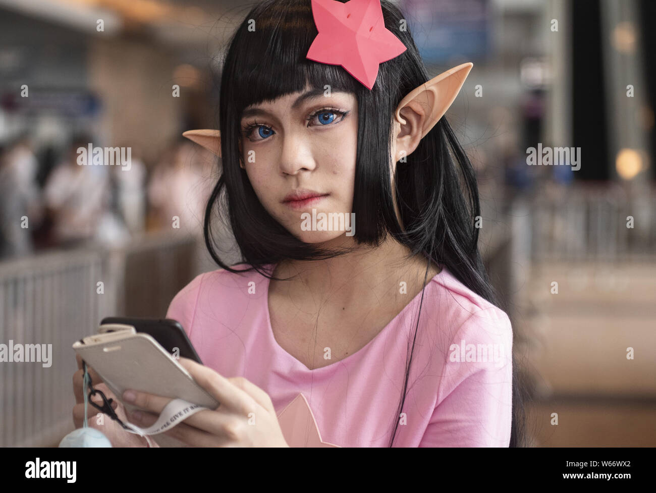 July 28, 2019, Hong Kong, China: A cosplayer in character uses her ...