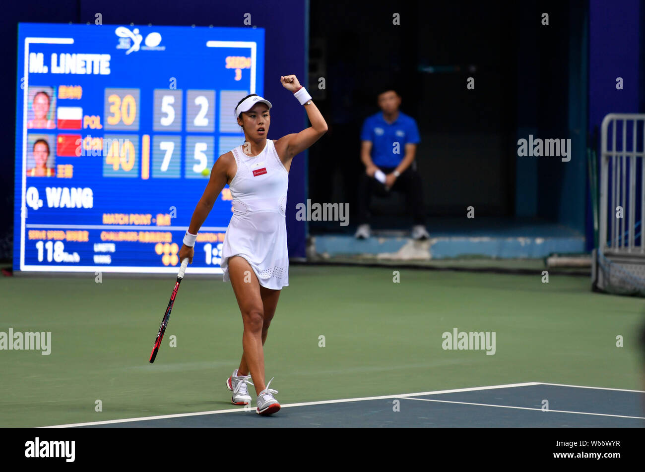 Wang Qiang of China celebrates after scoring against Magda Linette of ...