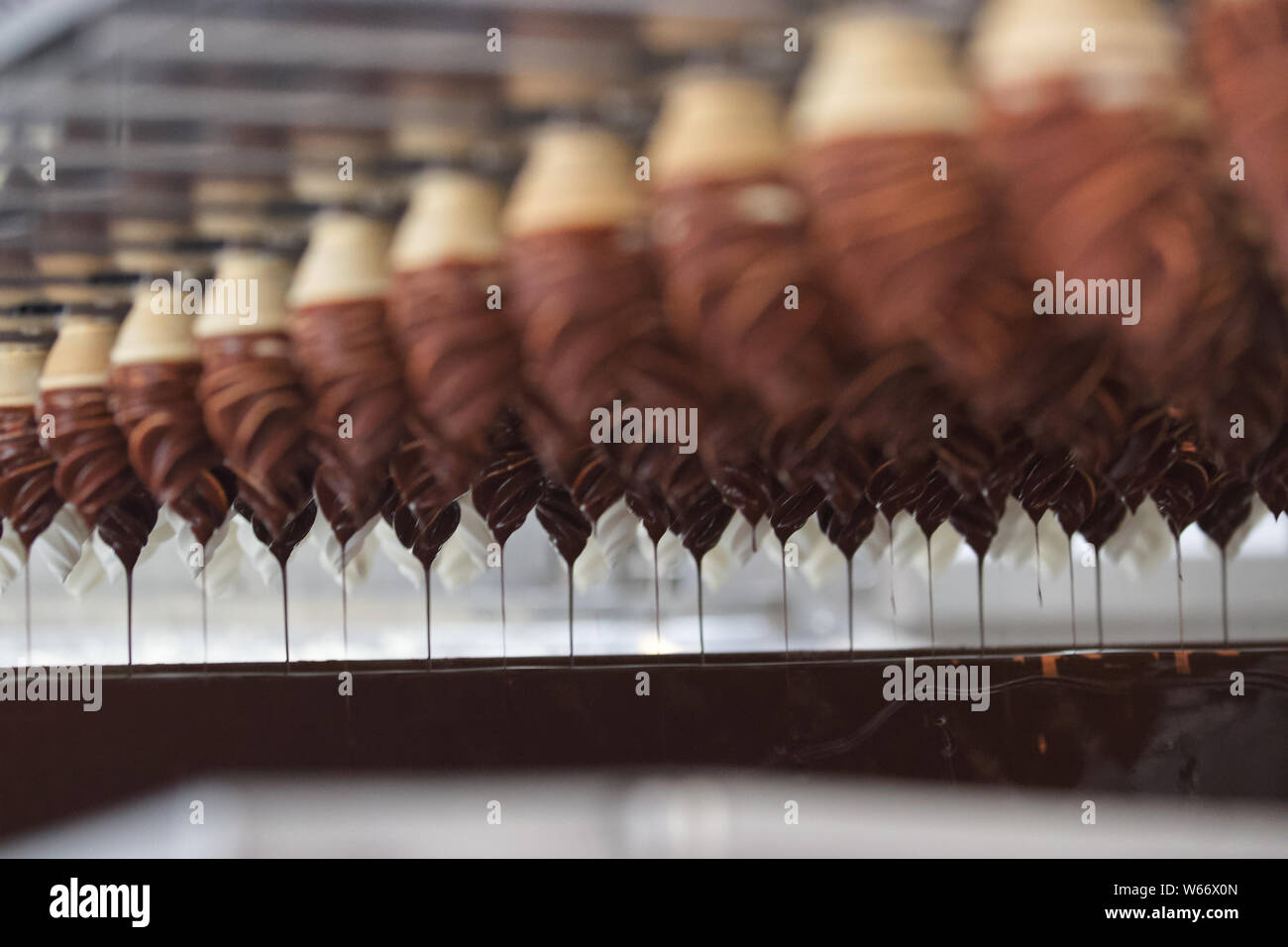 Yili torch ice creams are being produced on the assembly line at a ...