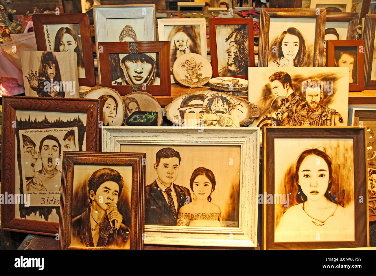 27-year-old Chinese man Peng Fang displays art works of pyrography at ...