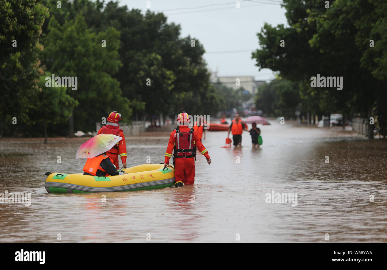 Chinese rescuers evacuate local residents in floodwater caused by heavy ...