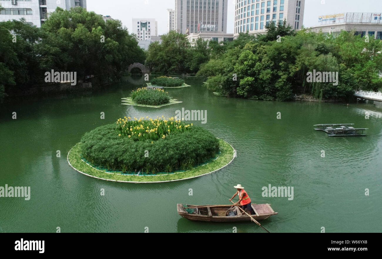 Aerial view of artificial floating islands set in a river for water ...