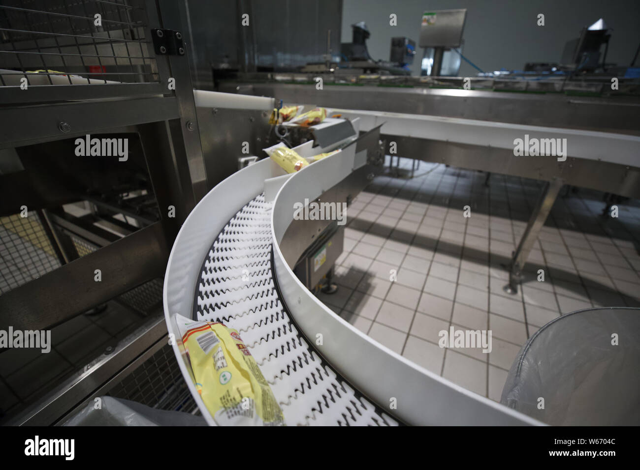 Yili torch ice creams are being produced on the assembly line at a ...