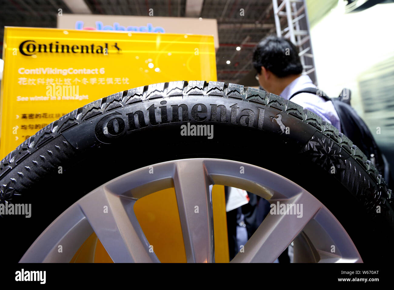 --FILE--People visit a stand of Continental Automotive Co.,Ltd. during ...