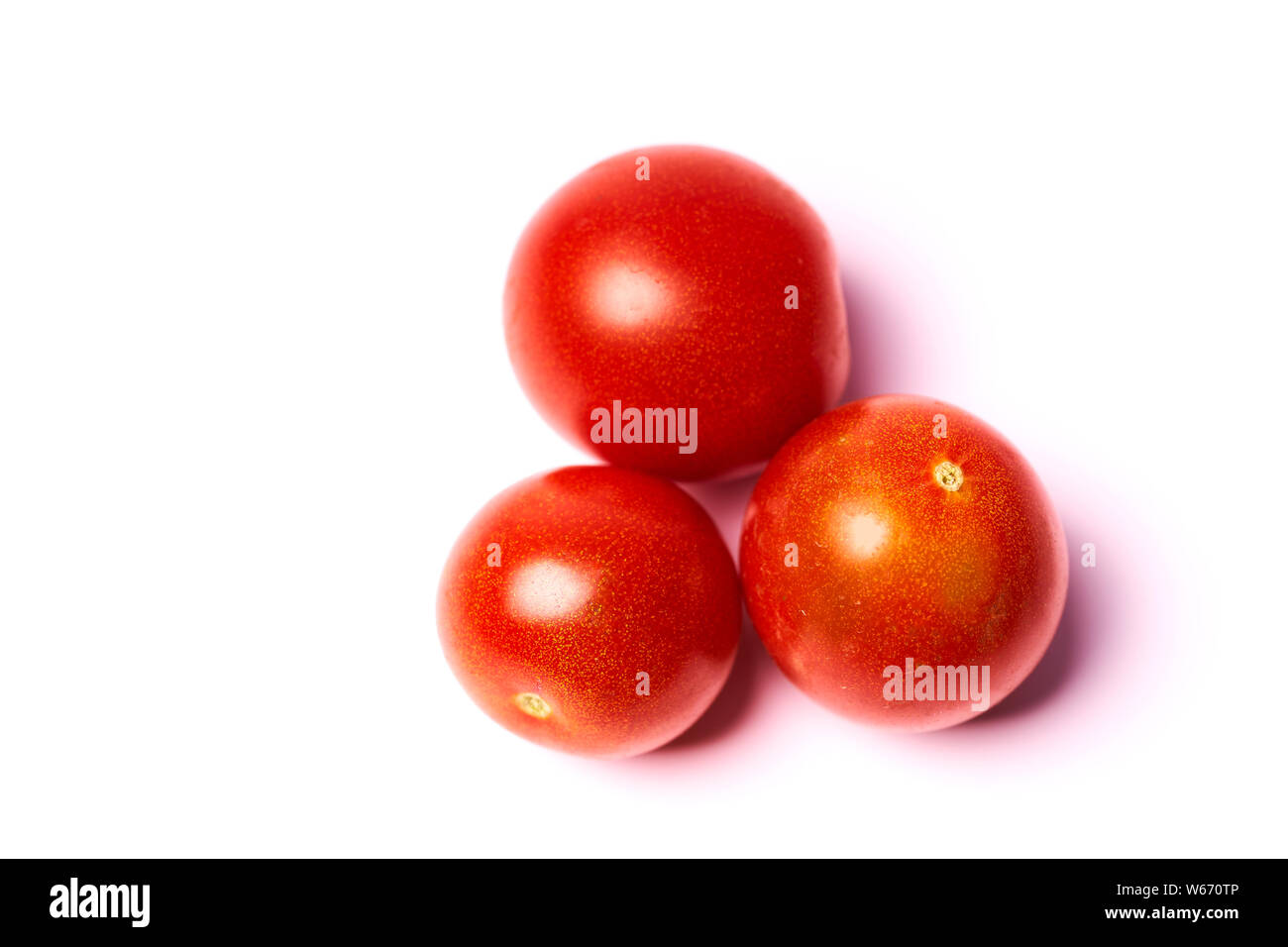 Three red tomatoes isolated on white background Stock Photo - Alamy