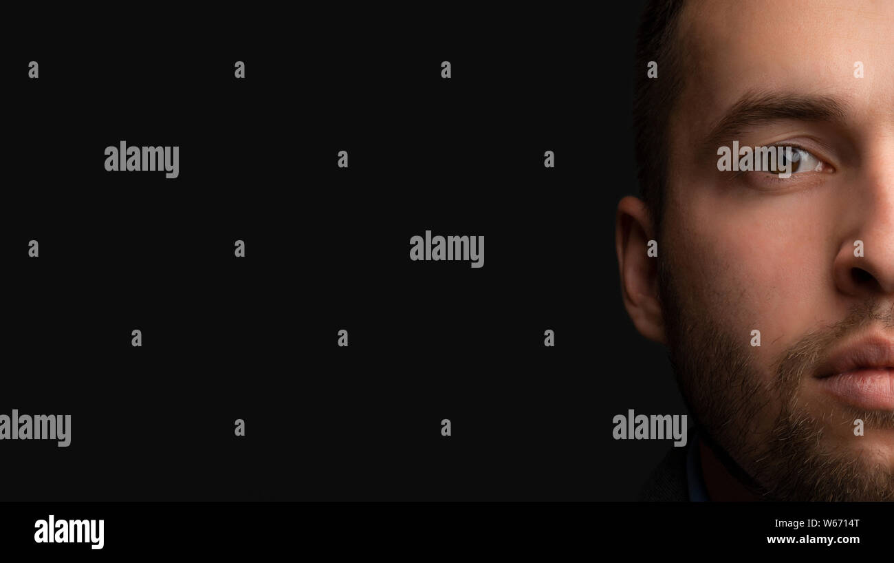 Semi face portrait of serious caucasian man Stock Photo - Alamy