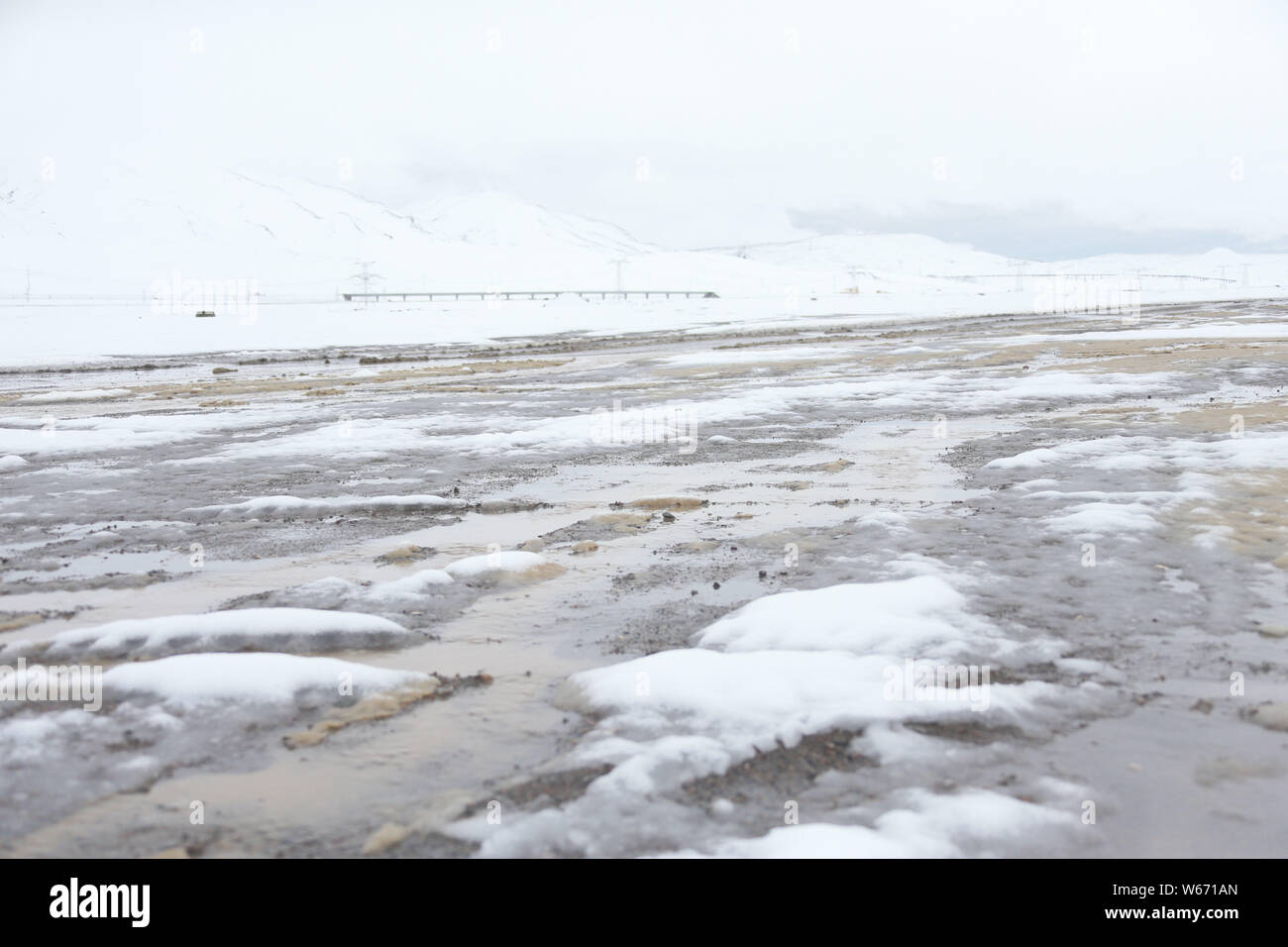 Mountains are covered with snow during the summer days in Golmud city ...