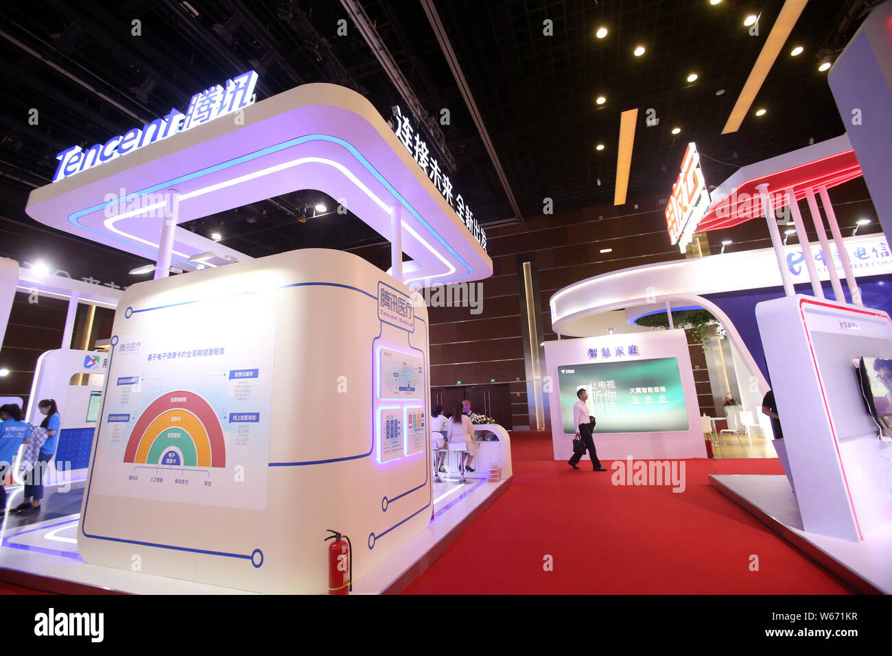 --FILE--People visit the stand of Tencent during the 2018 China ...