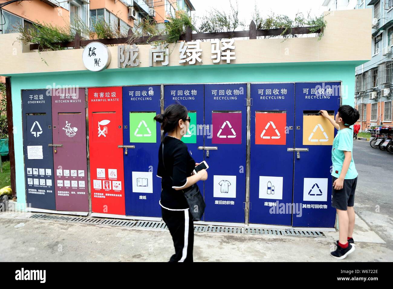 A young boy throws rubbish into a smart bin deployed to meet the new ...