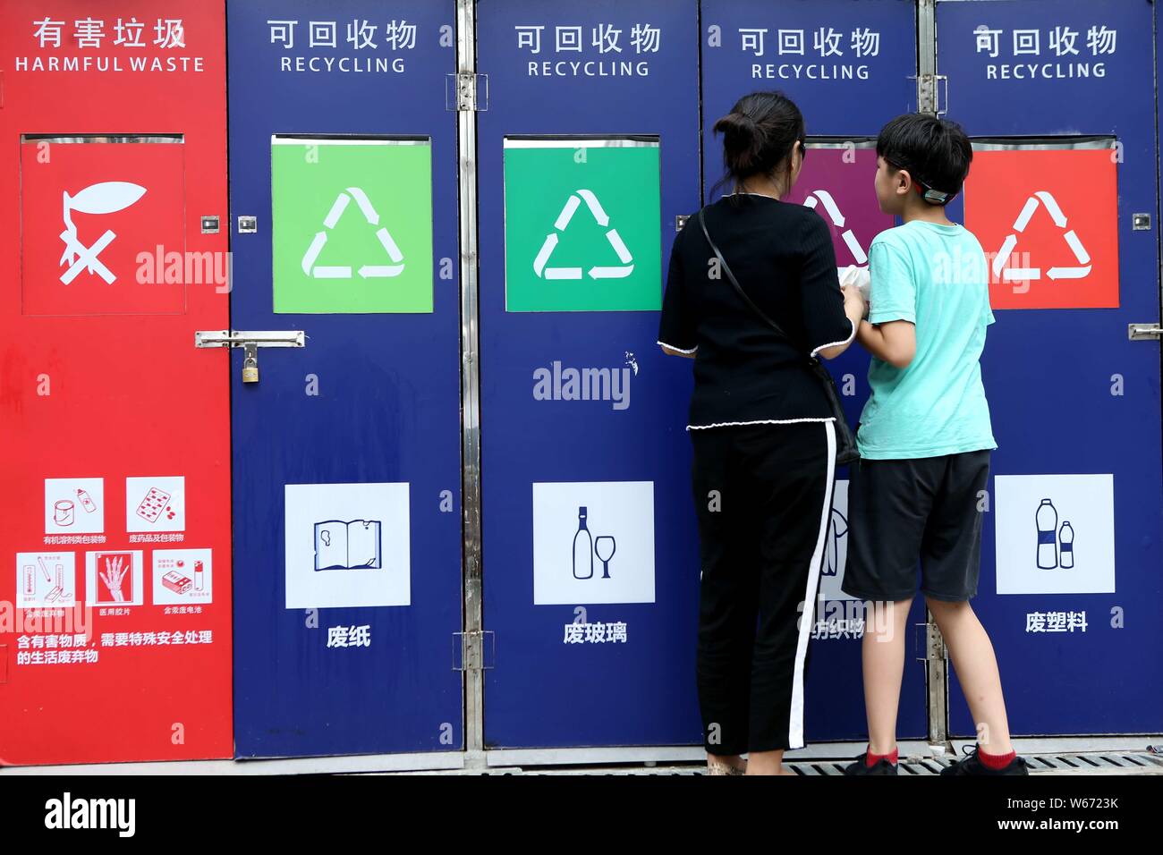 A young boy throws rubbish into a smart bin deployed to meet the new ...