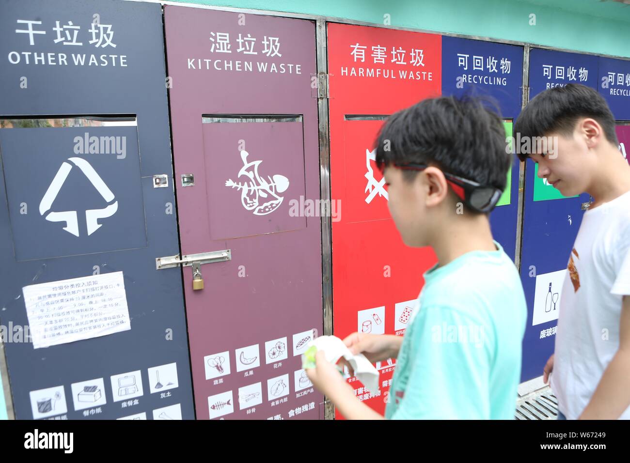 A young boy throws rubbish into a smart bin deployed to meet the new ...