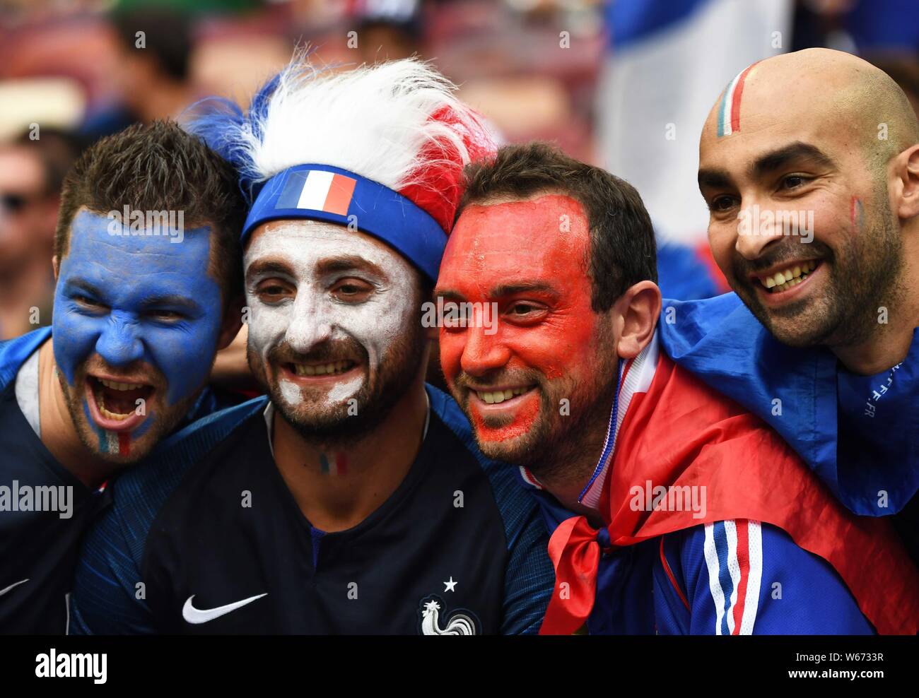 French fans who are dressed up are pictured before the final match ...