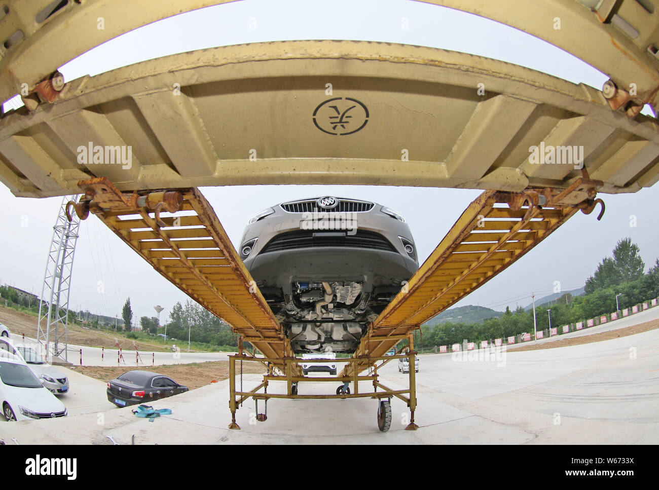 A commercial vehicle drives into the first freight train carrying ...